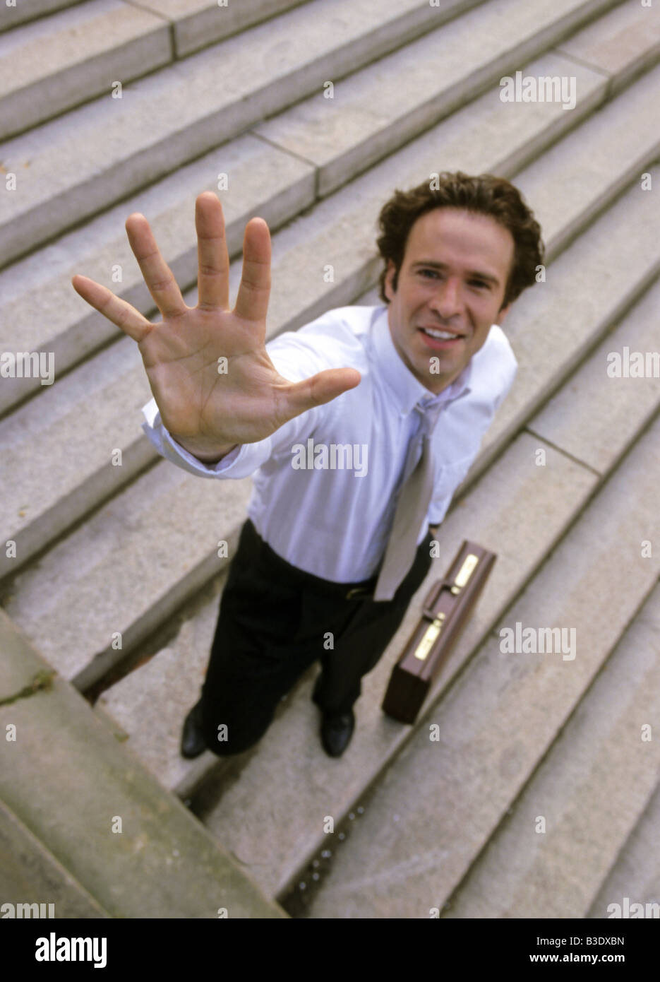 Businessman giving high five Stock Photo - Alamy