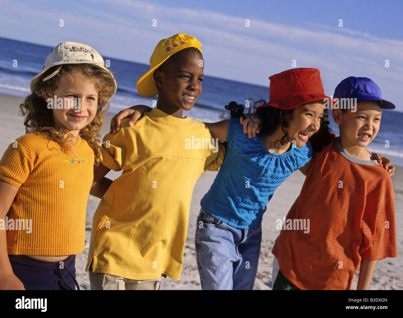 Mixed race kids together at a beach Stock Photo - Alamy