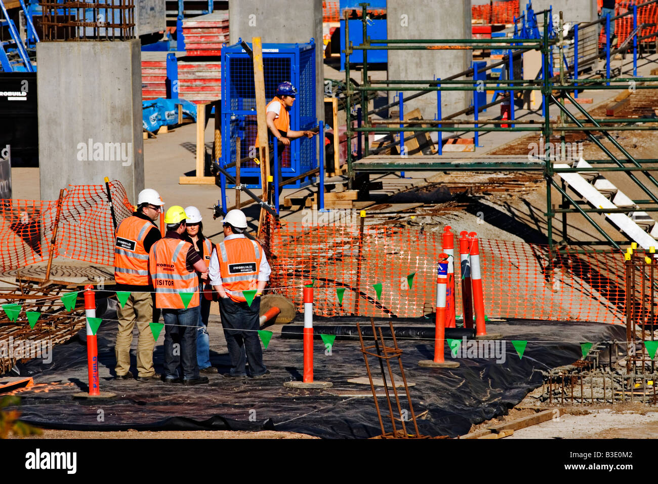 Construction / A group of Building Associates conduct a meeting on a ...