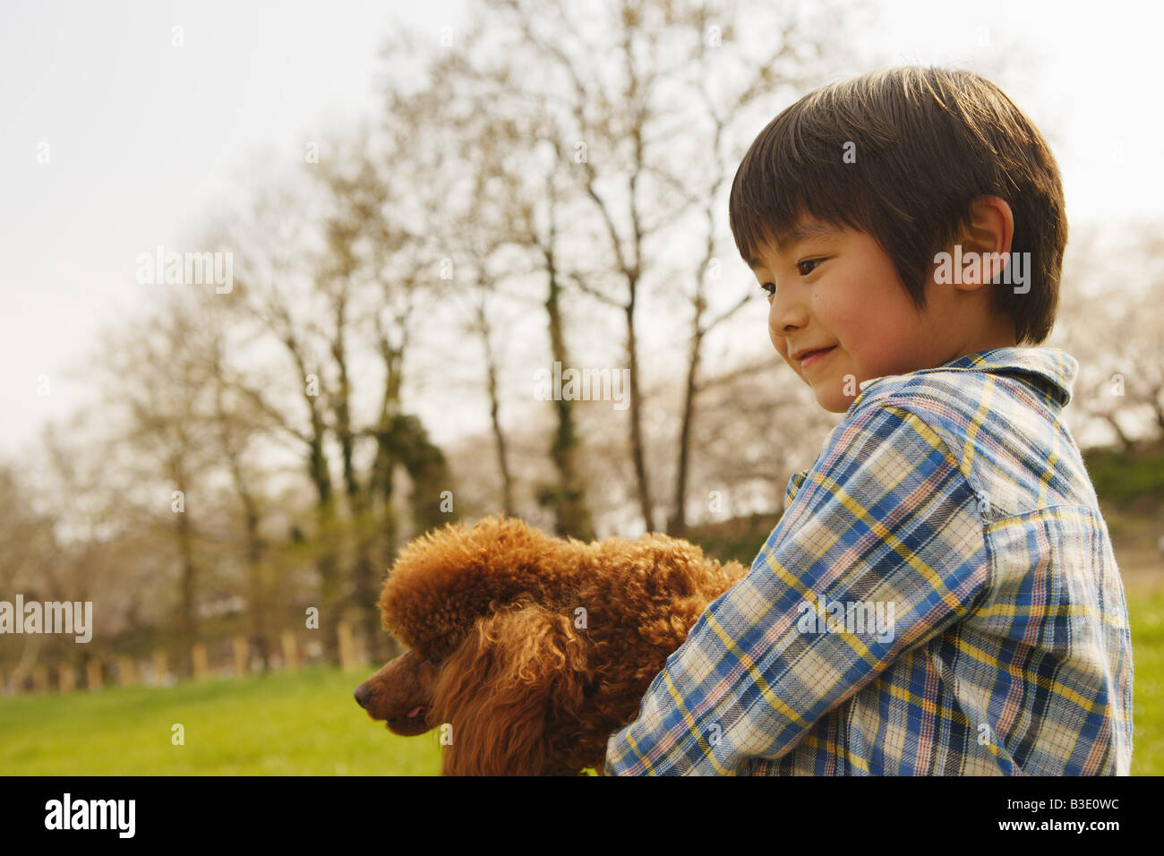 Asian boy with pet dog hi-res stock photography and images - Alamy