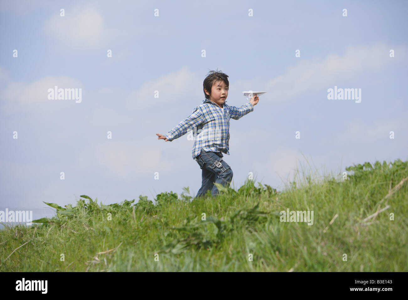 Black children paper airplane hi-res stock photography and images - Alamy