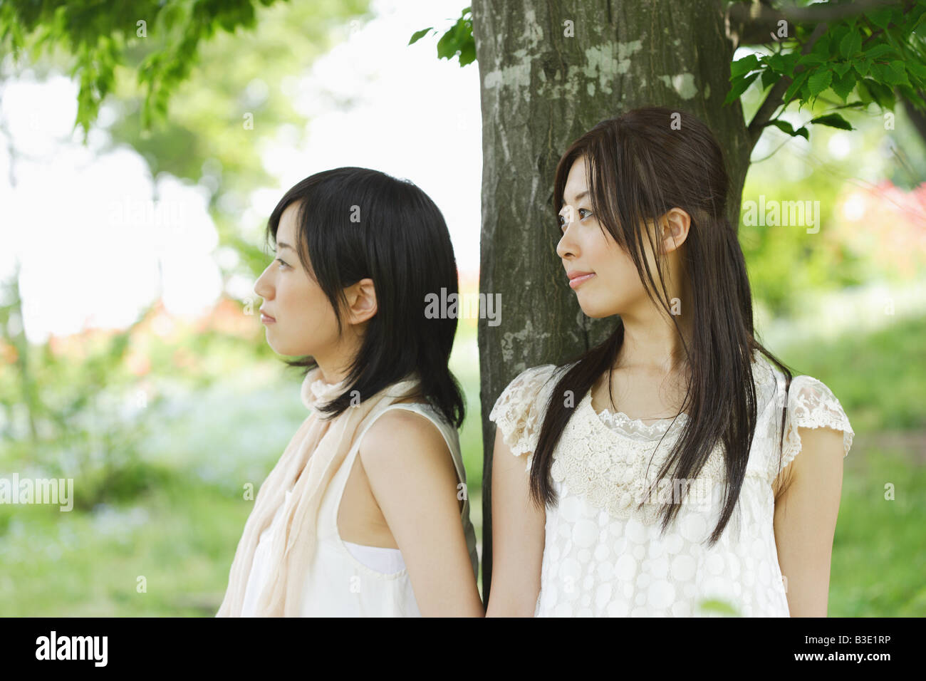 Two young sad women Stock Photo - Alamy