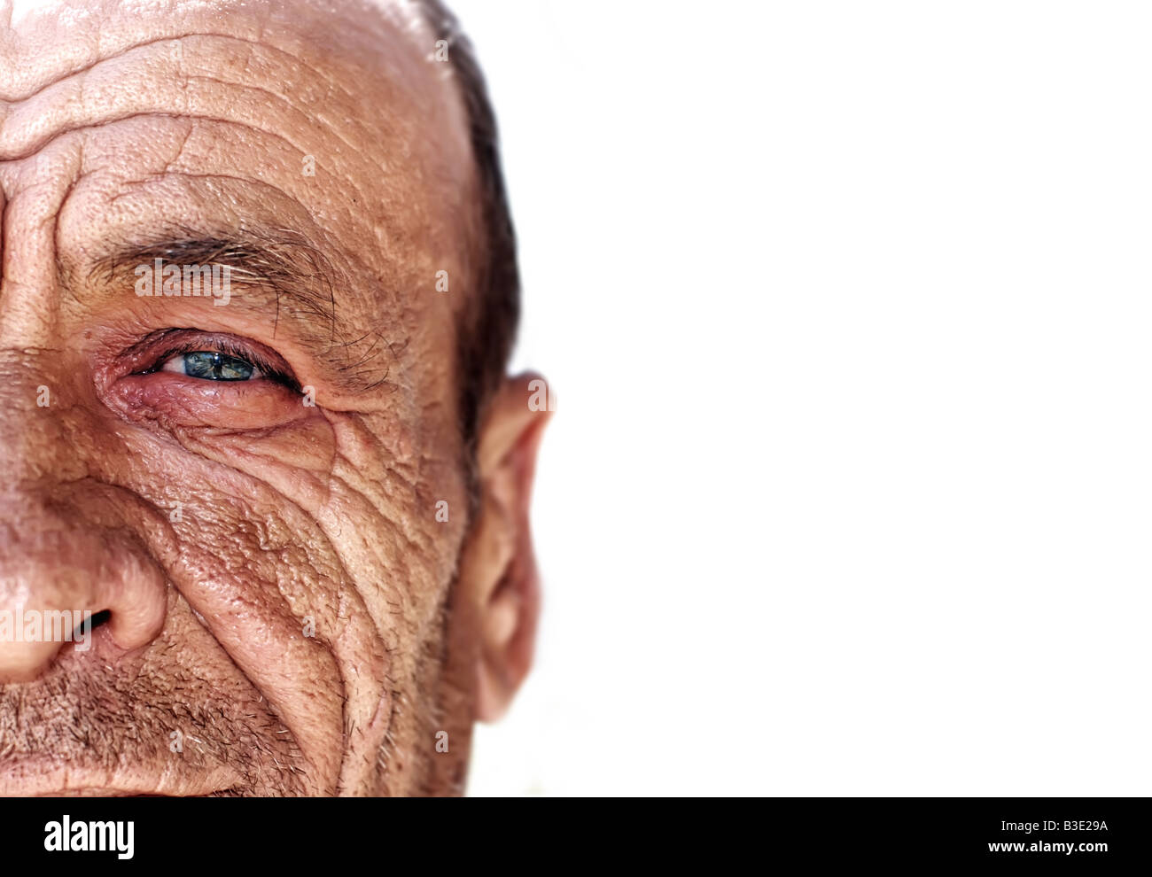 Old wrinkled man against white background Stock Photo - Alamy