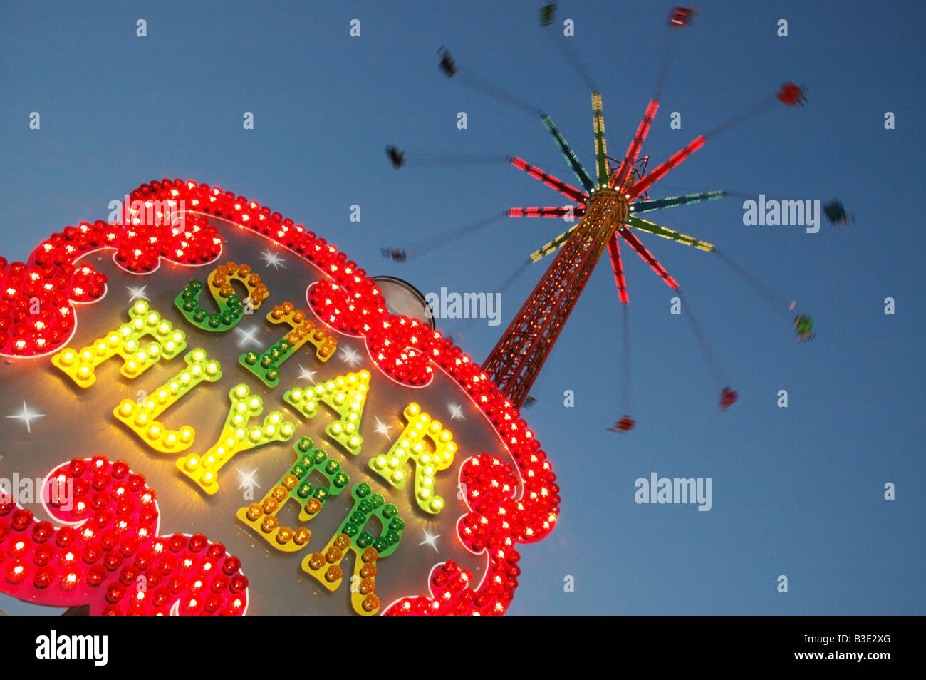 colourful fairground at dusk Stock Photo - Alamy