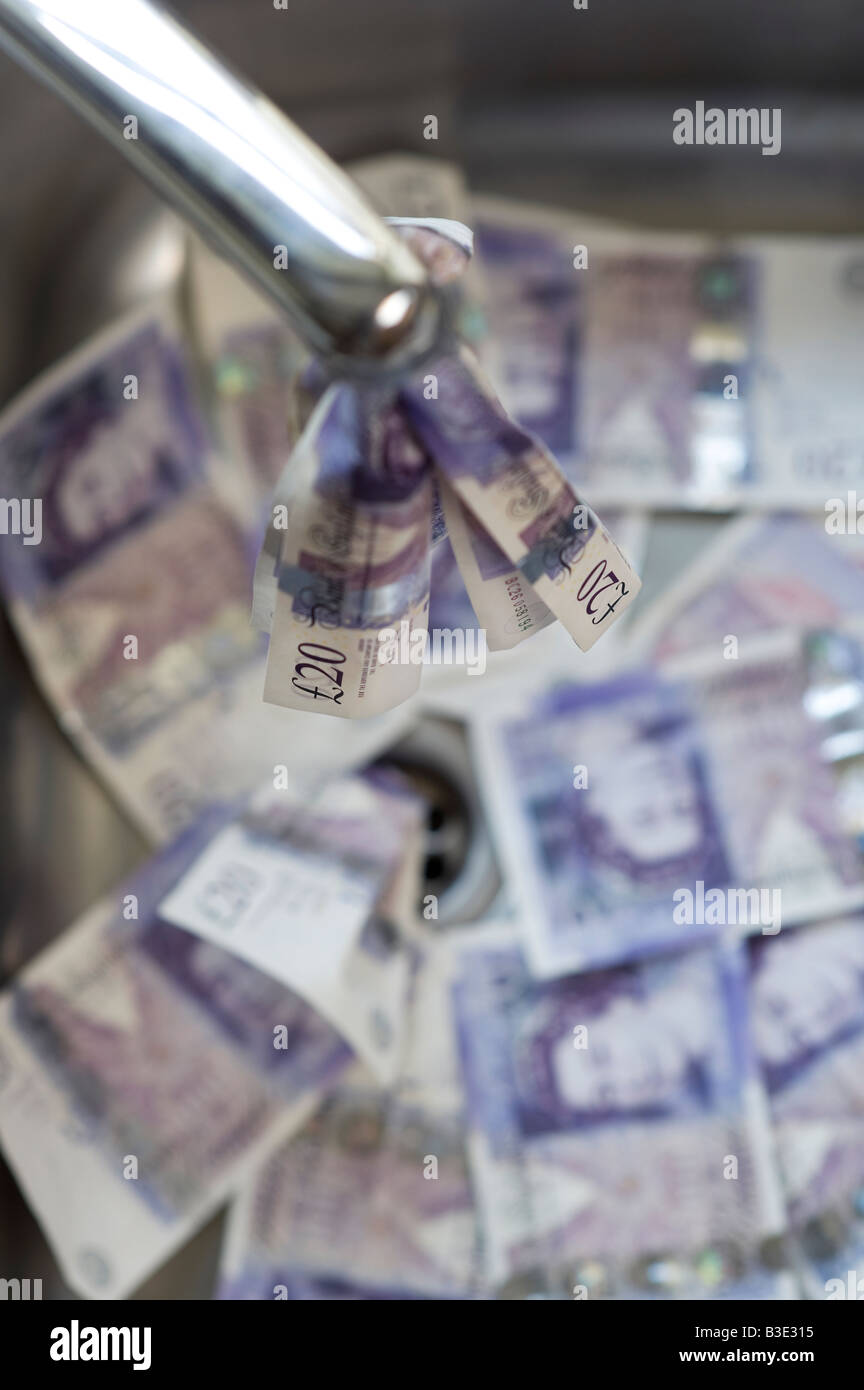 Money down drain hi-res stock photography and images - Alamy