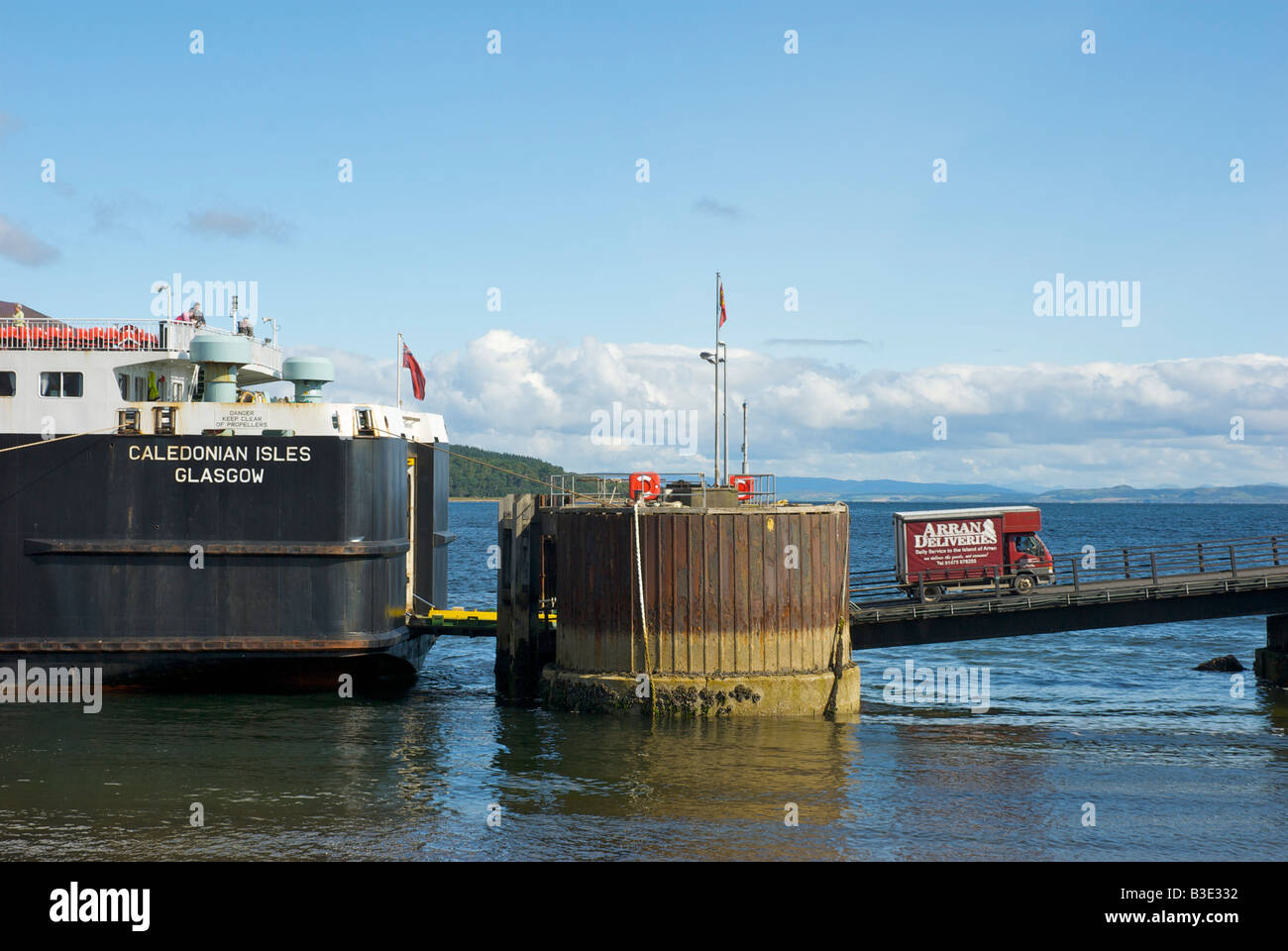 Delivery van driving off the ferry from Ardrossan, onto quay at Brodick ...