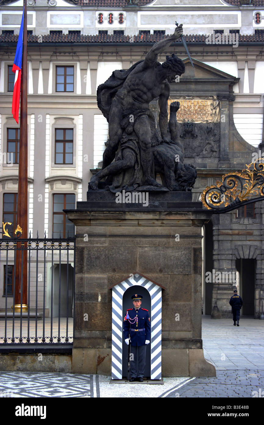 An honor guard stands at the main entrance to Prague Castle marked by ...