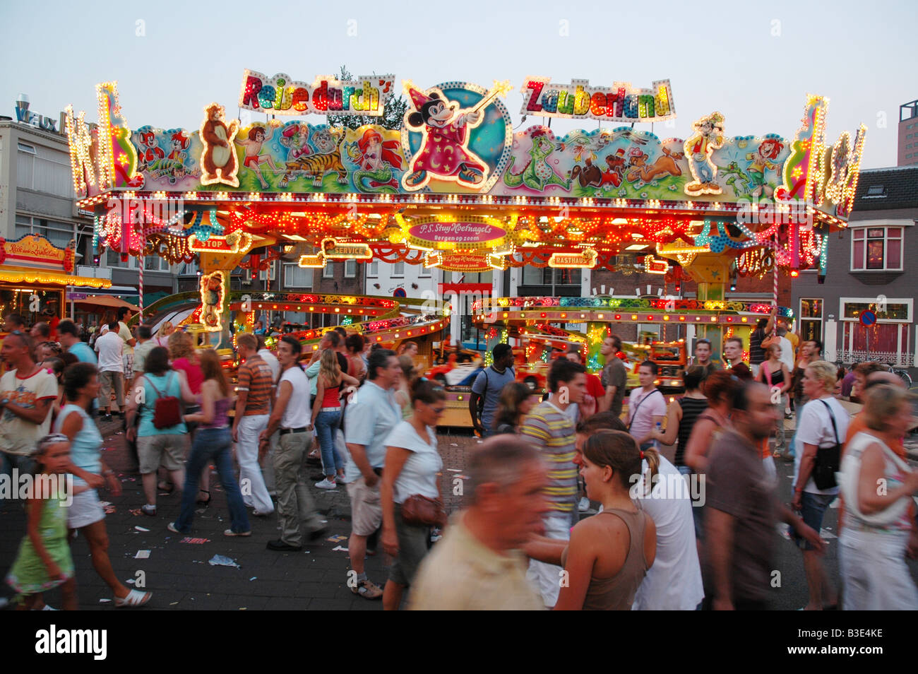 colourful fairground with spectators at dusk Tilburg Netherlands Stock ...