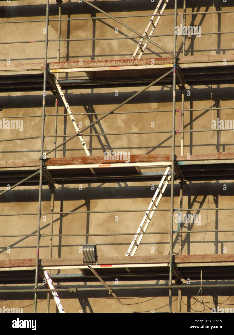 ladders and scaffolding on property building Stock Photo - Alamy