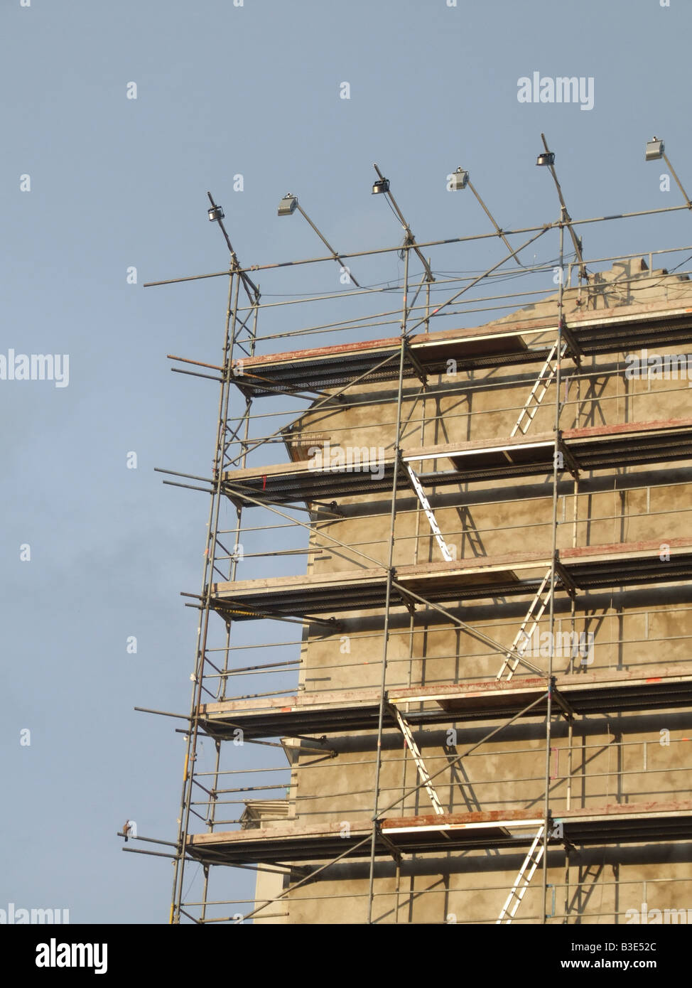ladders and scaffolding on property building Stock Photo - Alamy