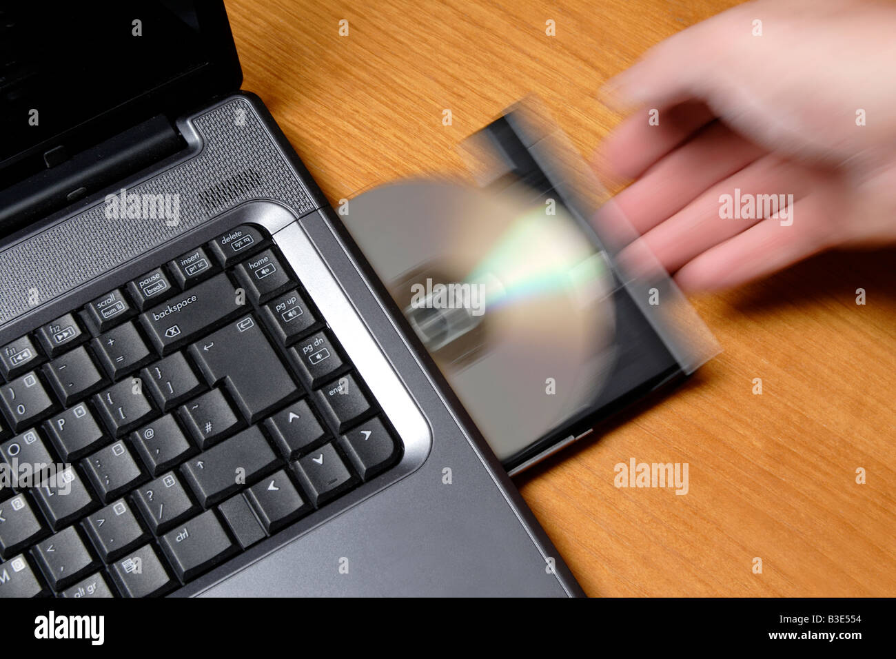 person closeing disk drive on laptop computer Stock Photo - Alamy