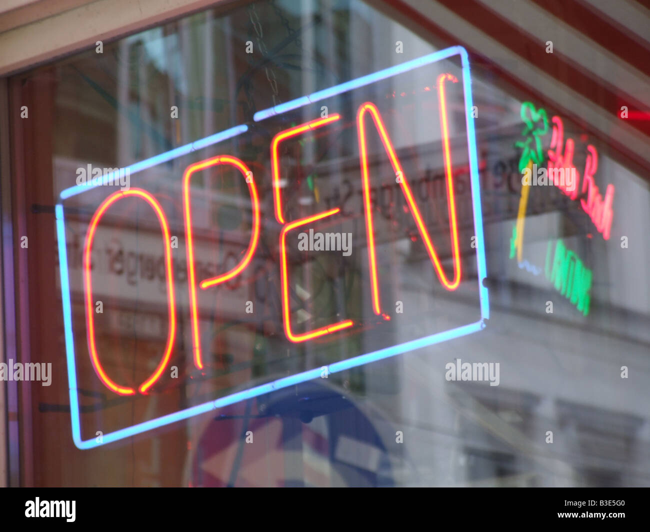 illuminated open neon sign in shop window Stock Photo - Alamy