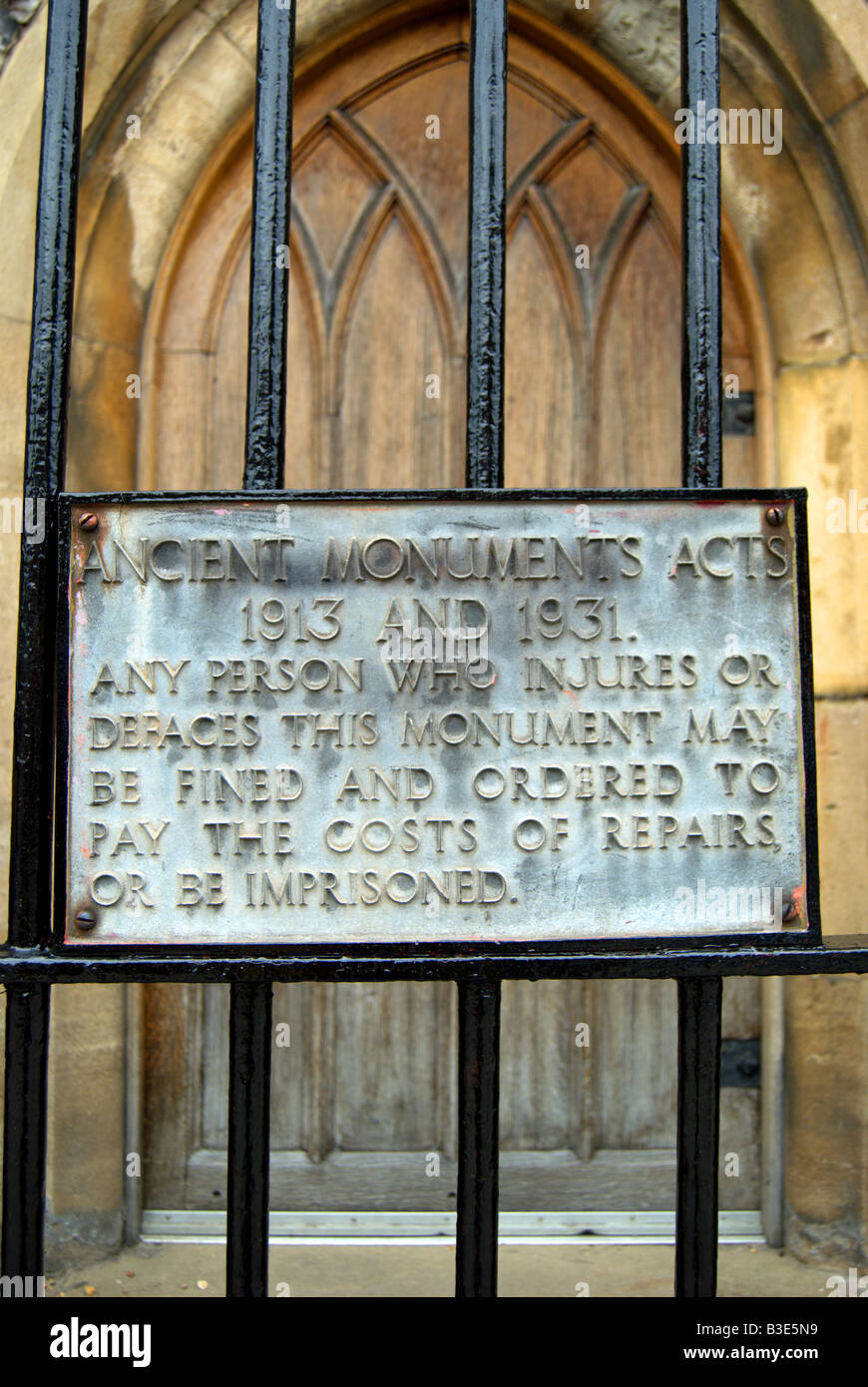 british sign on railings detailing the ancient monuments acts of 1913 ...