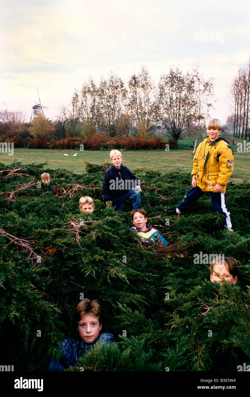 a group of young children posing for a photograph in the countryside ...