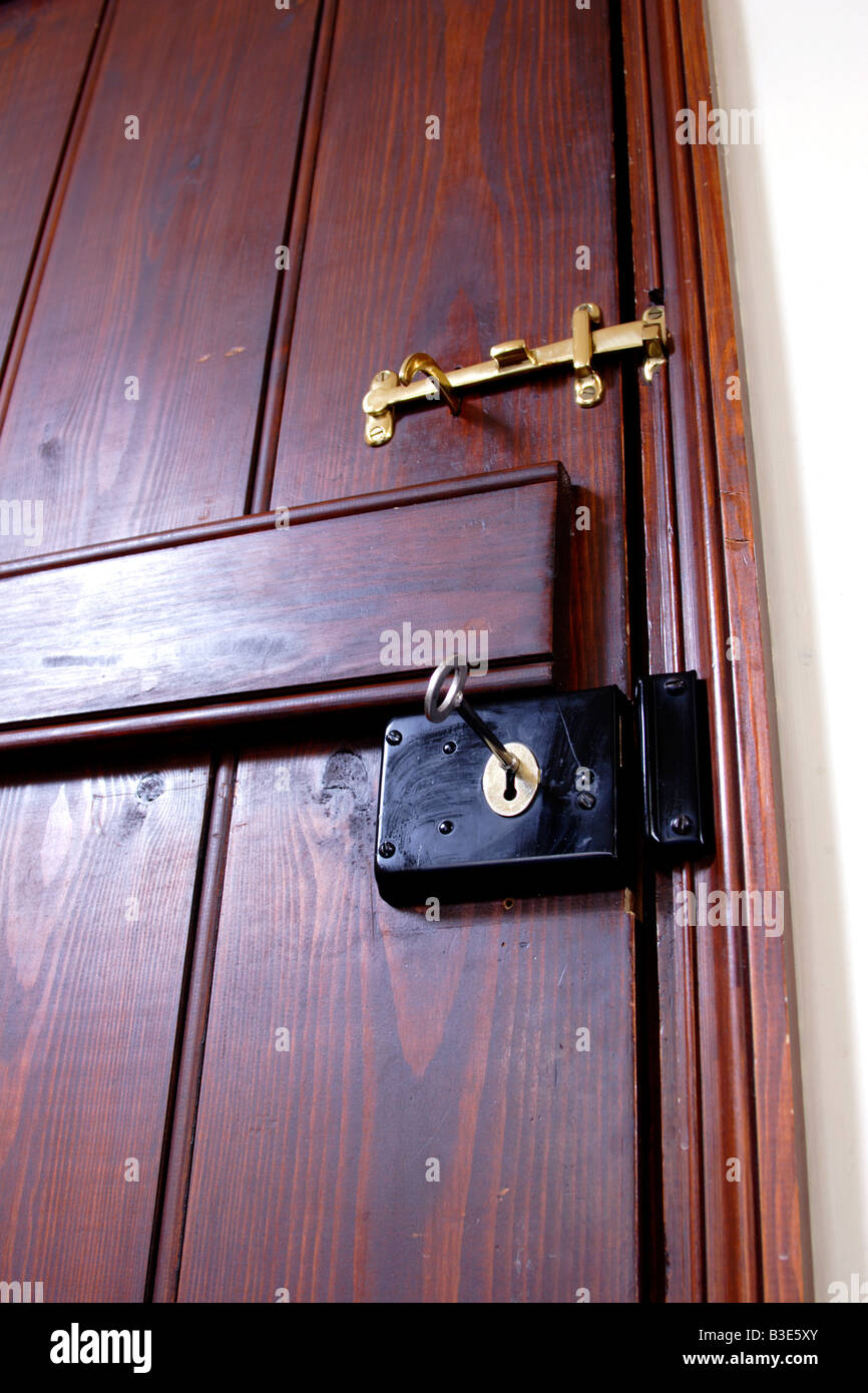 Old key in lock close up Stock Photo - Alamy