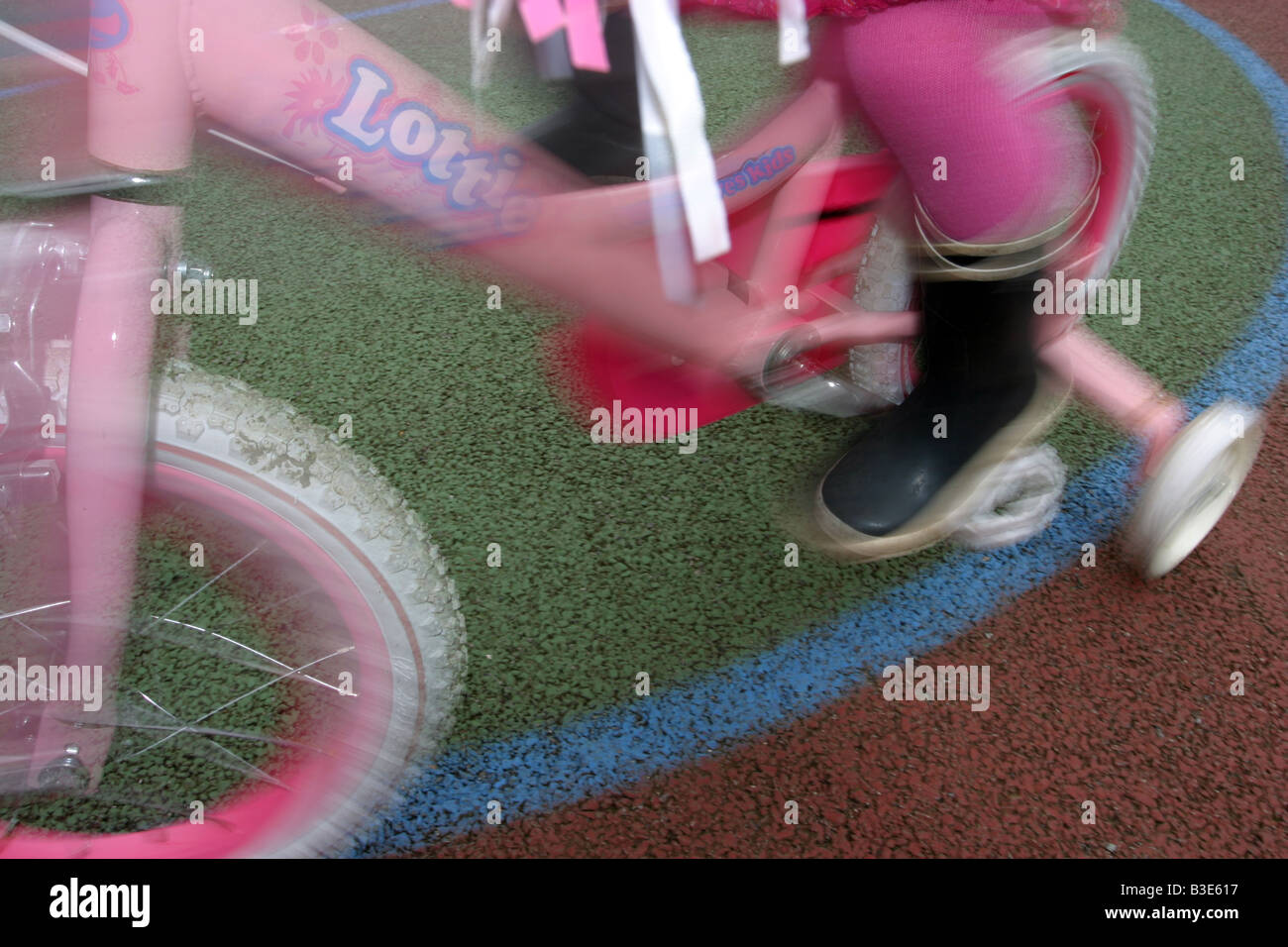 Toddler riding a bike Stock Photo - Alamy