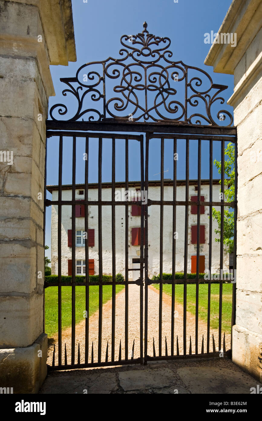 A large impressive Basque house behind its tall wrought iron gate ...