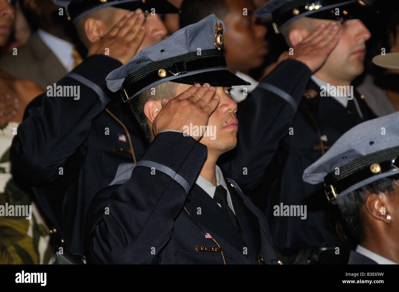 Police officers saluting Stock Photo - Alamy