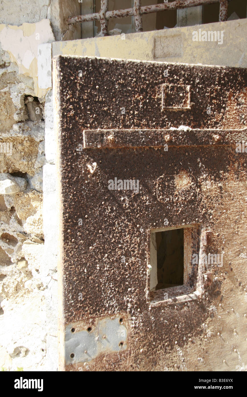 old rusty steel prison cell door in derelict jail Stock Photo - Alamy