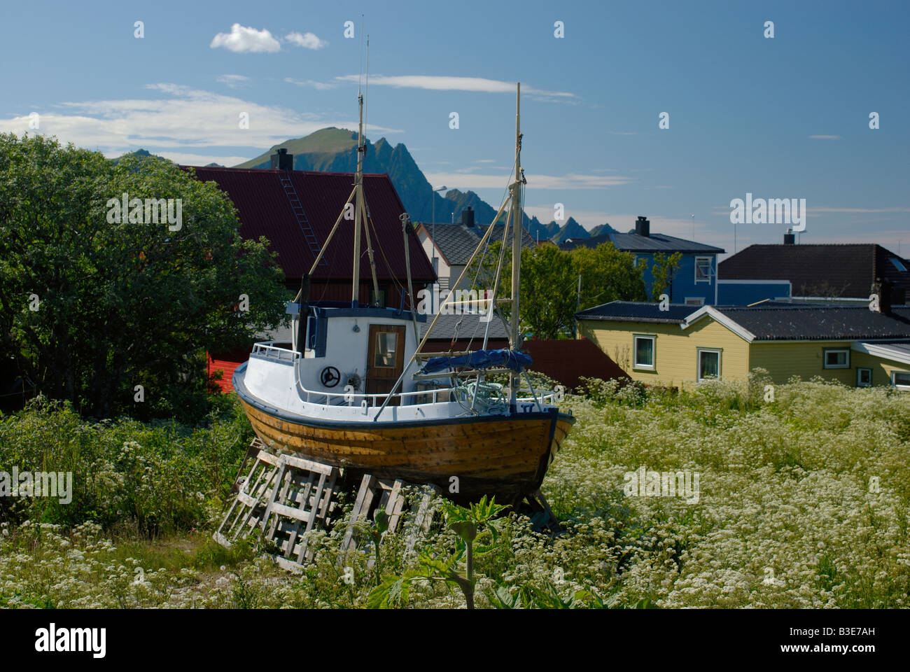 Small fishing boat sitting in a backyard Andenes Andoya Northern Norway ...