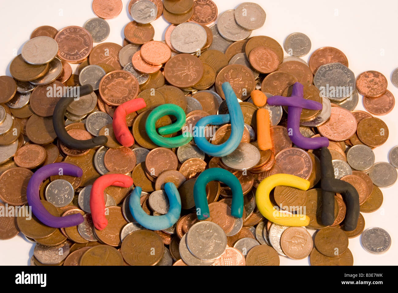 The words "credit crunch" on a pile of coins Stock Photo - Alamy