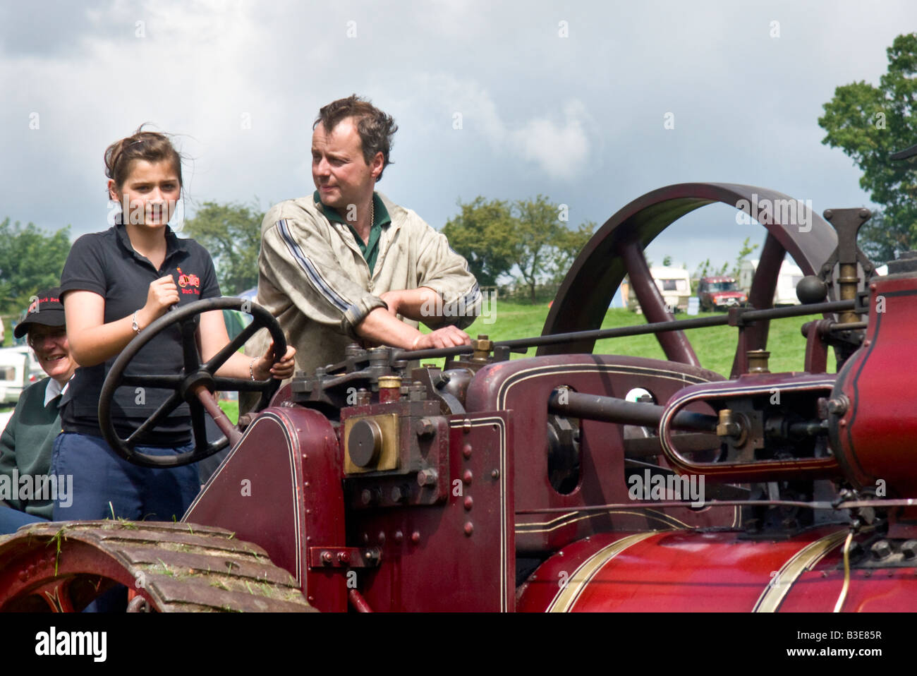 Young girl driving a traction engine at Masham Steam Engine and fair ...