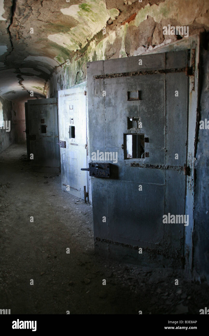 one old moody dark derelict empty prison cell Stock Photo - Alamy