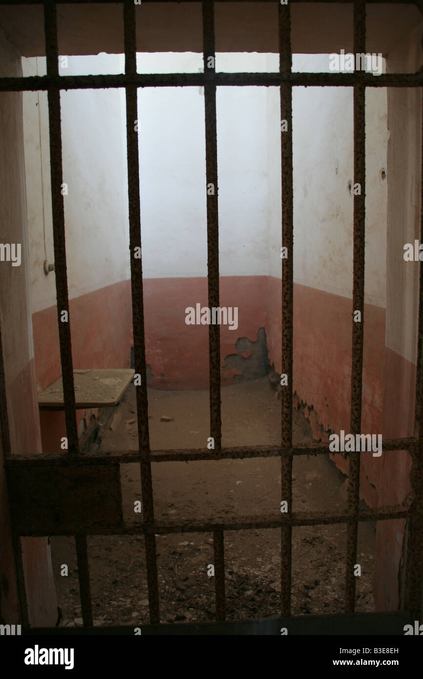 one old moody dark derelict empty prison cell Stock Photo - Alamy