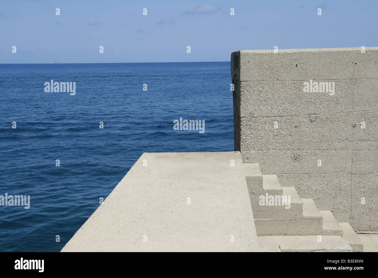 graphic sea wall structure and blue sky in sun Stock Photo - Alamy