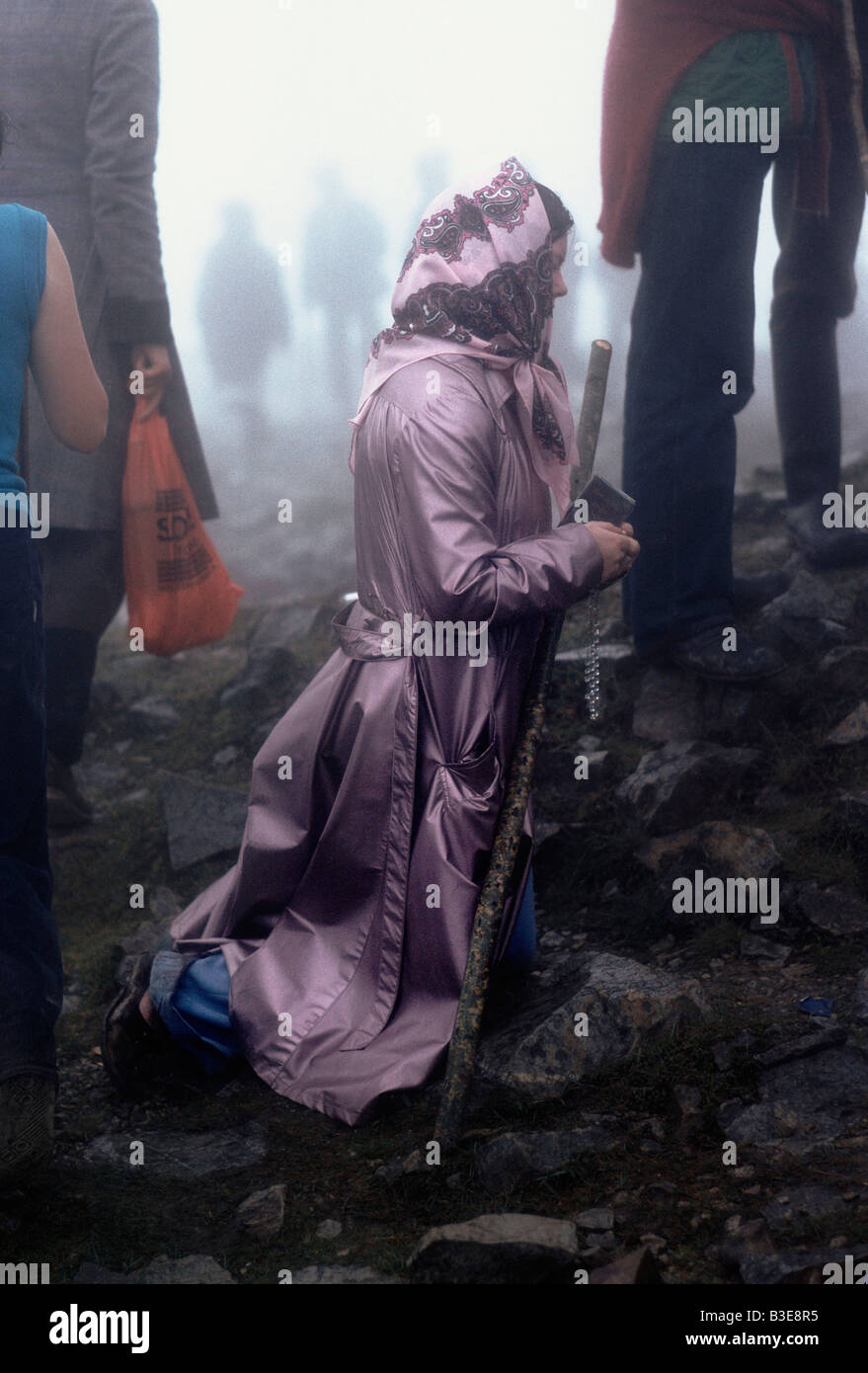 WOMAN KNEELING PRAYING ON ROCKY GROUND PILGRIM IN CROAGH PATRICK S ...