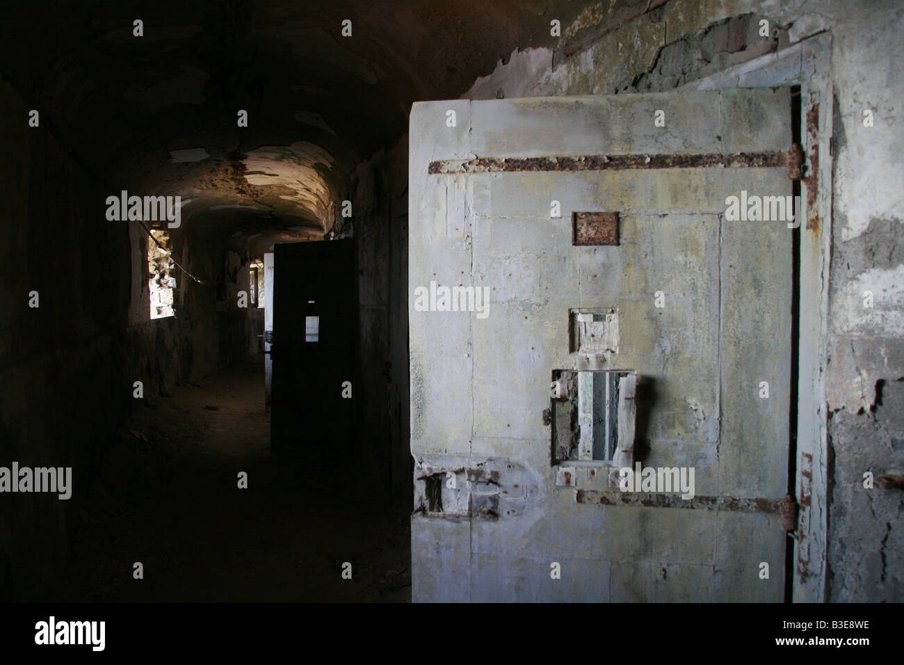 one old moody dark derelict empty prison cell Stock Photo - Alamy