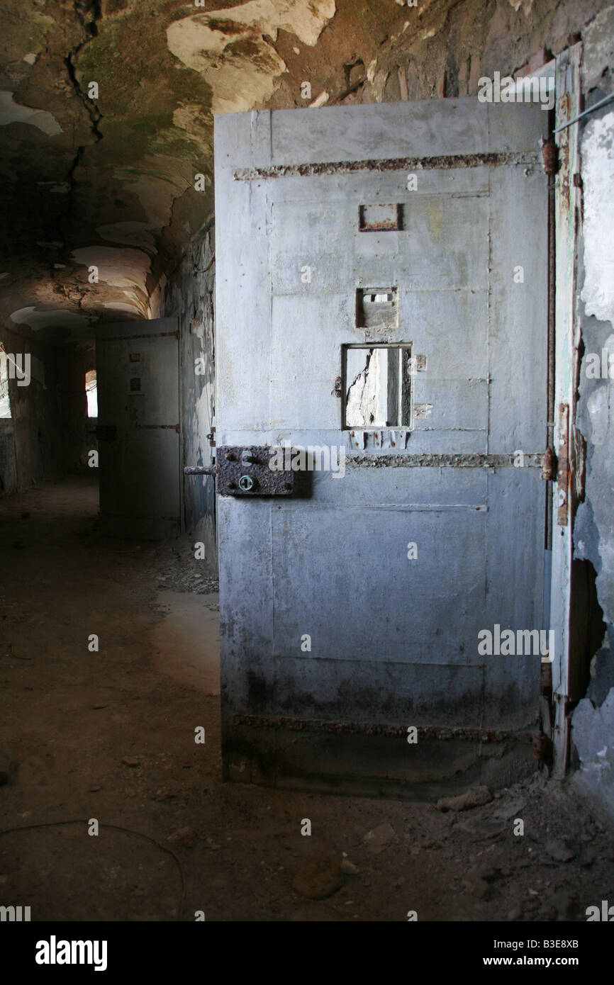 one old moody dark derelict empty prison cell Stock Photo - Alamy
