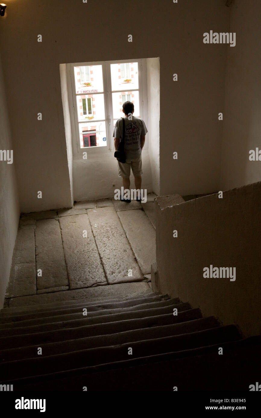 man looking out of window Stock Photo - Alamy