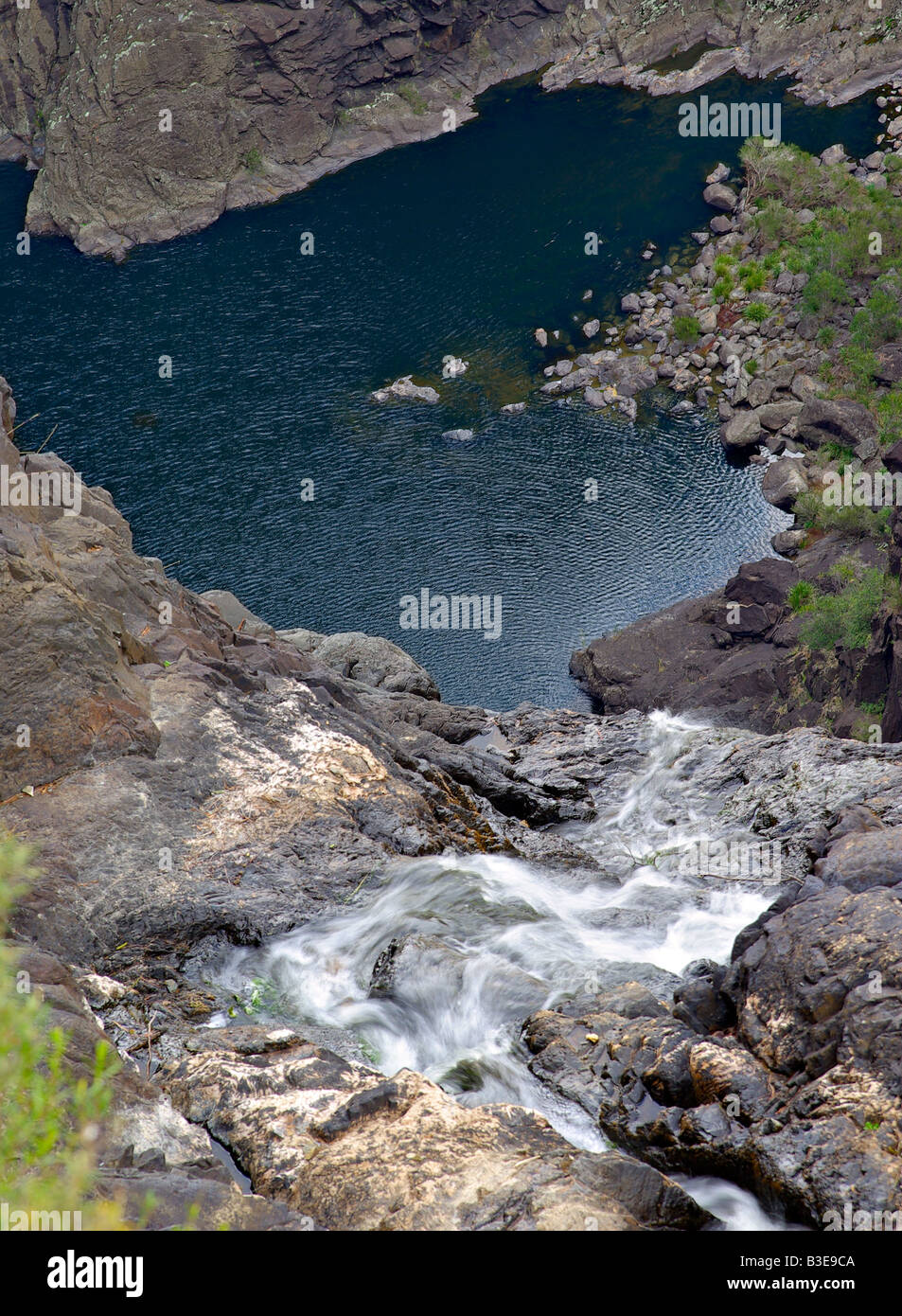 looking down at the waterfall going to the lake below Stock Photo - Alamy