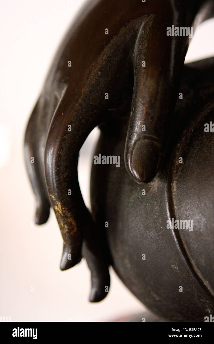 black bouddha hand statue Stock Photo - Alamy