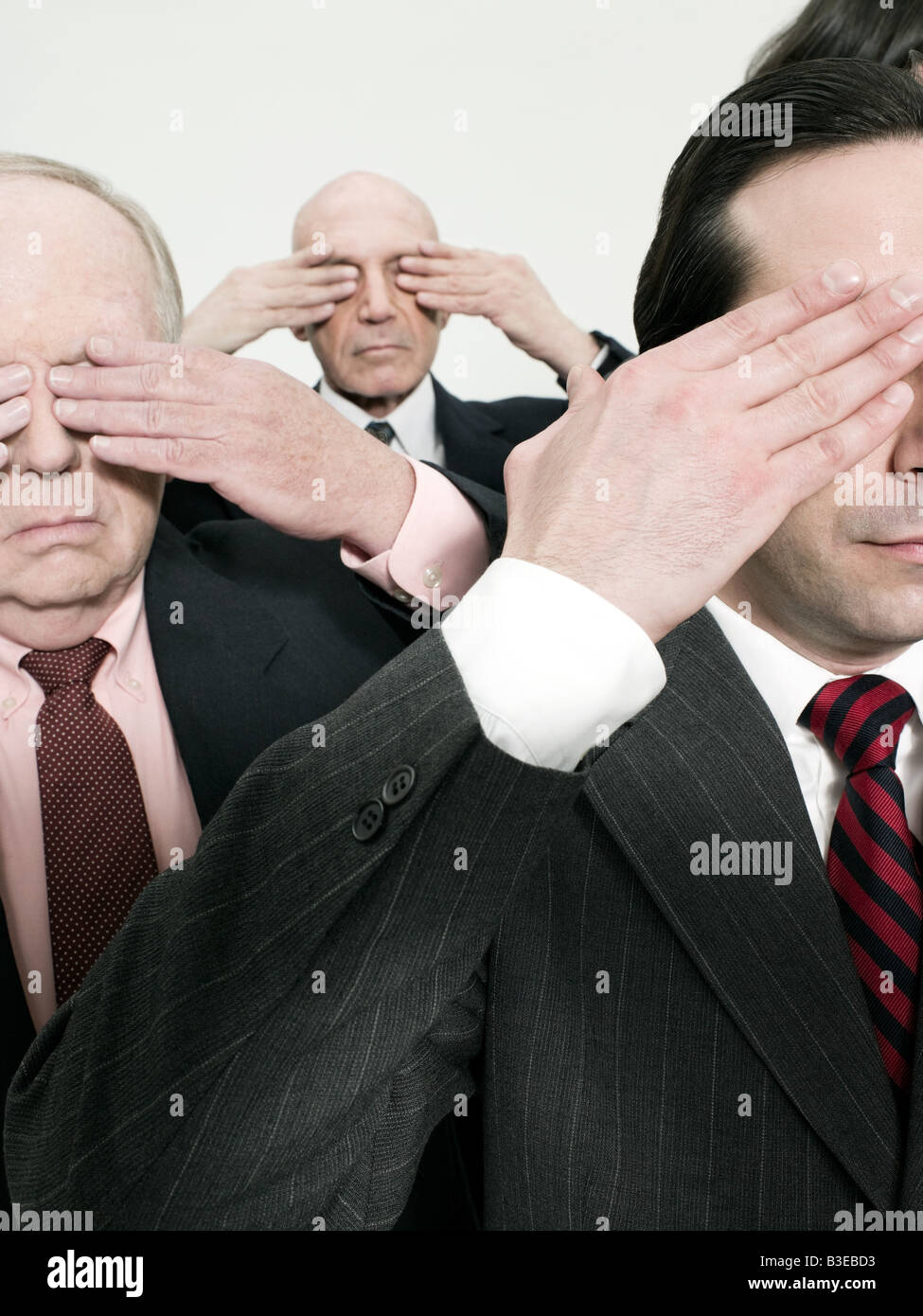 Businessmen covering eyes Stock Photo - Alamy