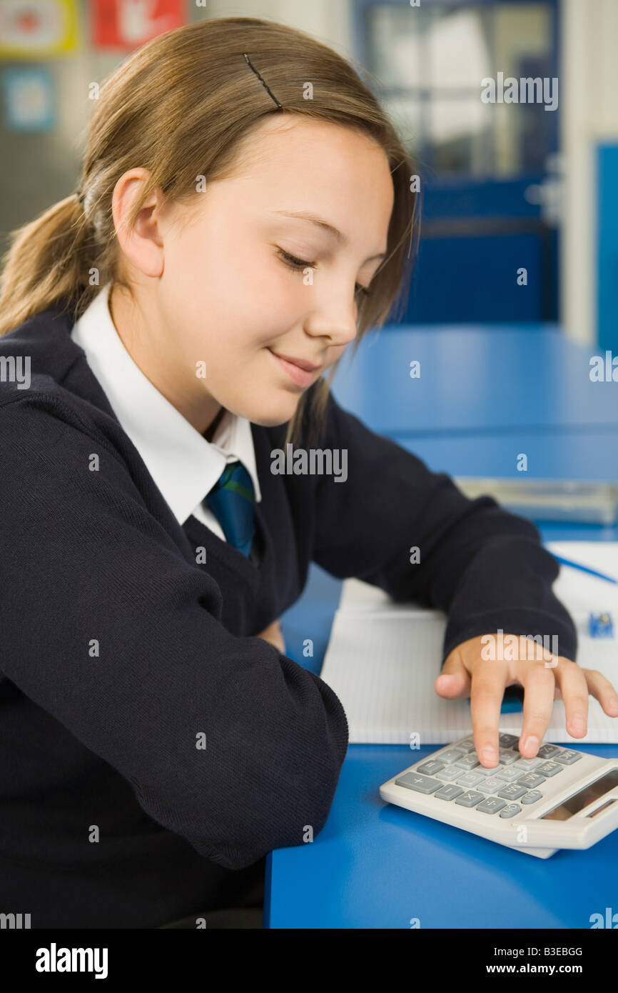 Girl using calculator Stock Photo - Alamy