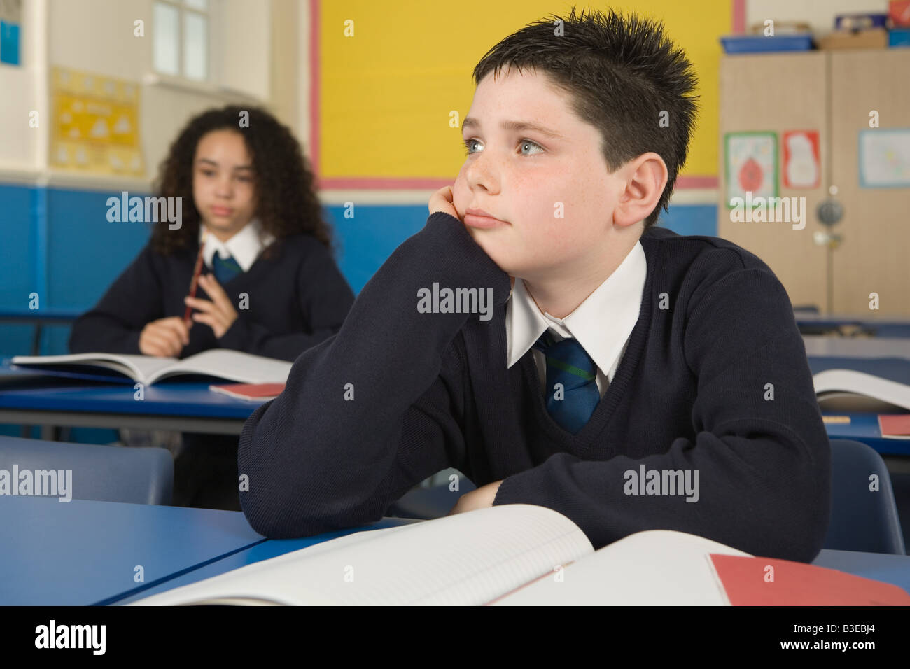 Bored students in classroom Stock Photo - Alamy