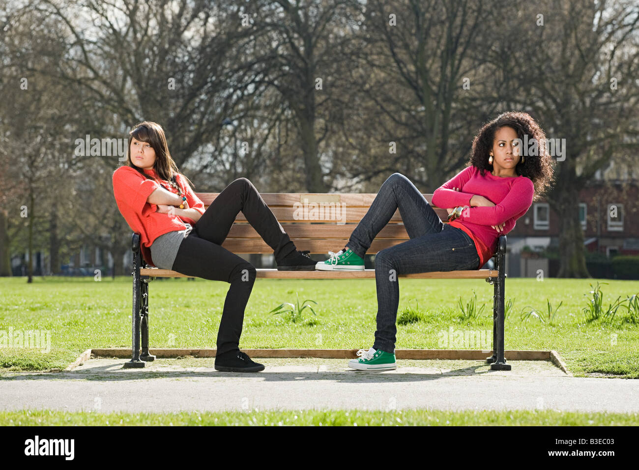 Teenage girls on bench Stock Photo - Alamy