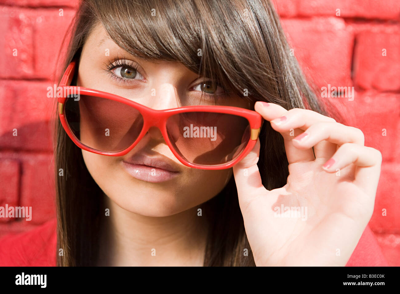 Girl wearing sunglasses Stock Photo - Alamy
