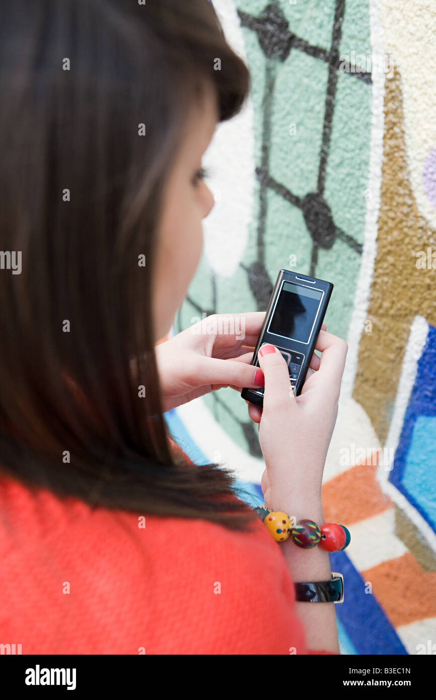 Girl using cellphone Stock Photo - Alamy