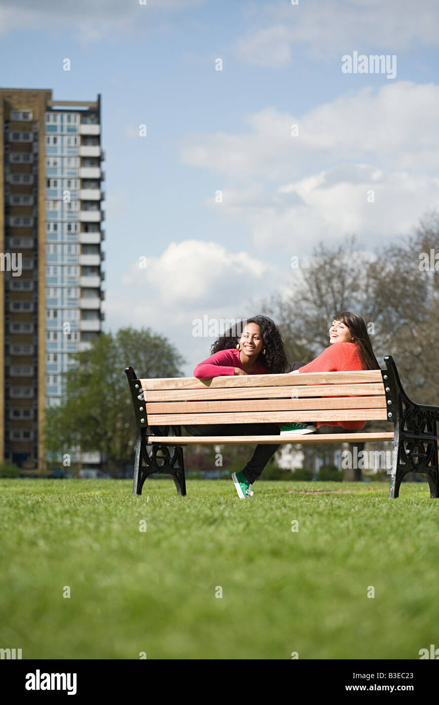 Two Girls Sitting On Park Bench High Resolution Stock Photography and ...