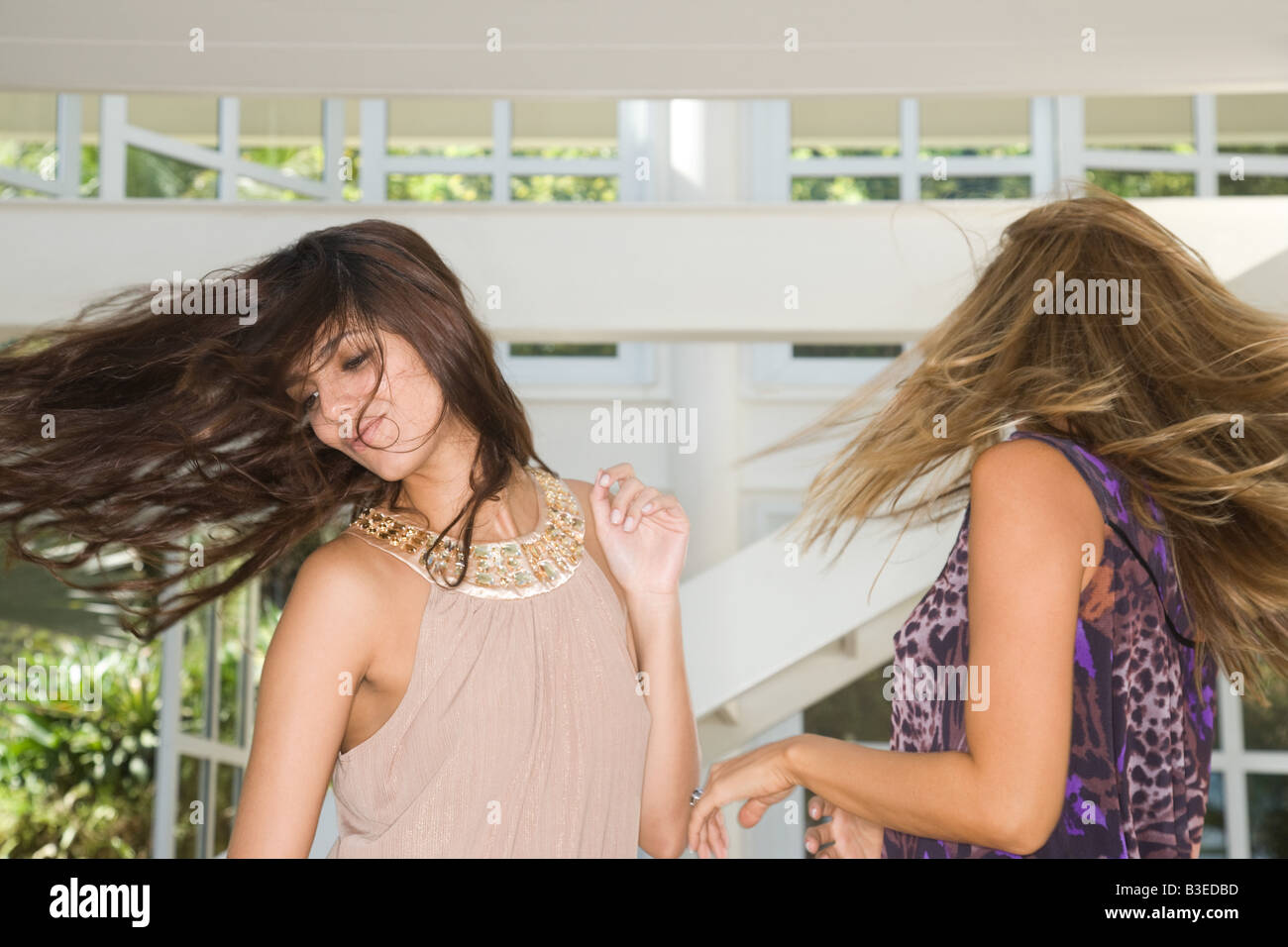 Two women dancing at home Stock Photo - Alamy