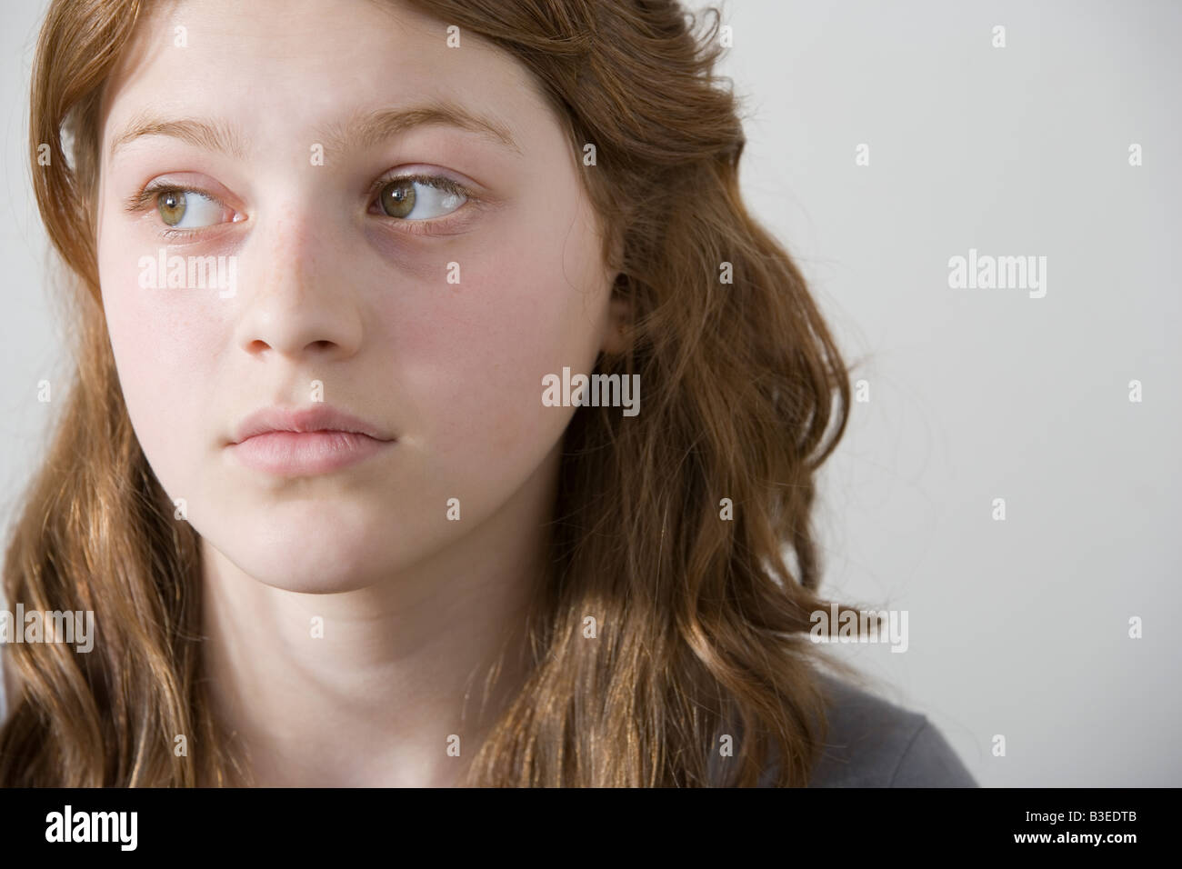 A teenage girl thinking Stock Photo - Alamy