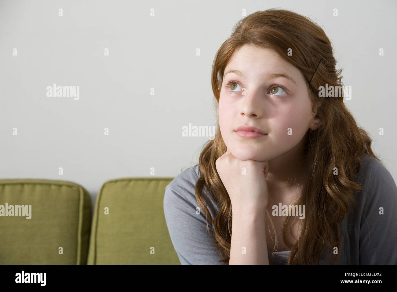 A teenage girl thinking Stock Photo - Alamy
