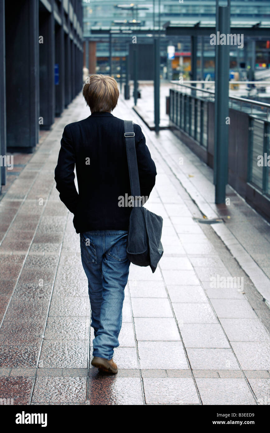 Boy Walking Alone In City Stock Photos & Boy Walking Alone In City ...