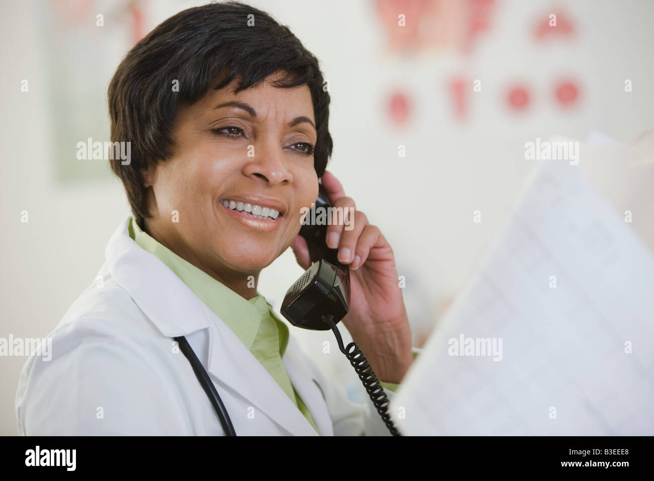 A doctor using a phone Stock Photo - Alamy