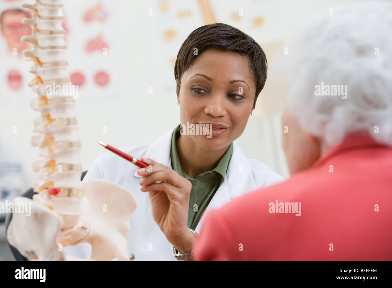 A doctor explaining to a patient Stock Photo - Alamy
