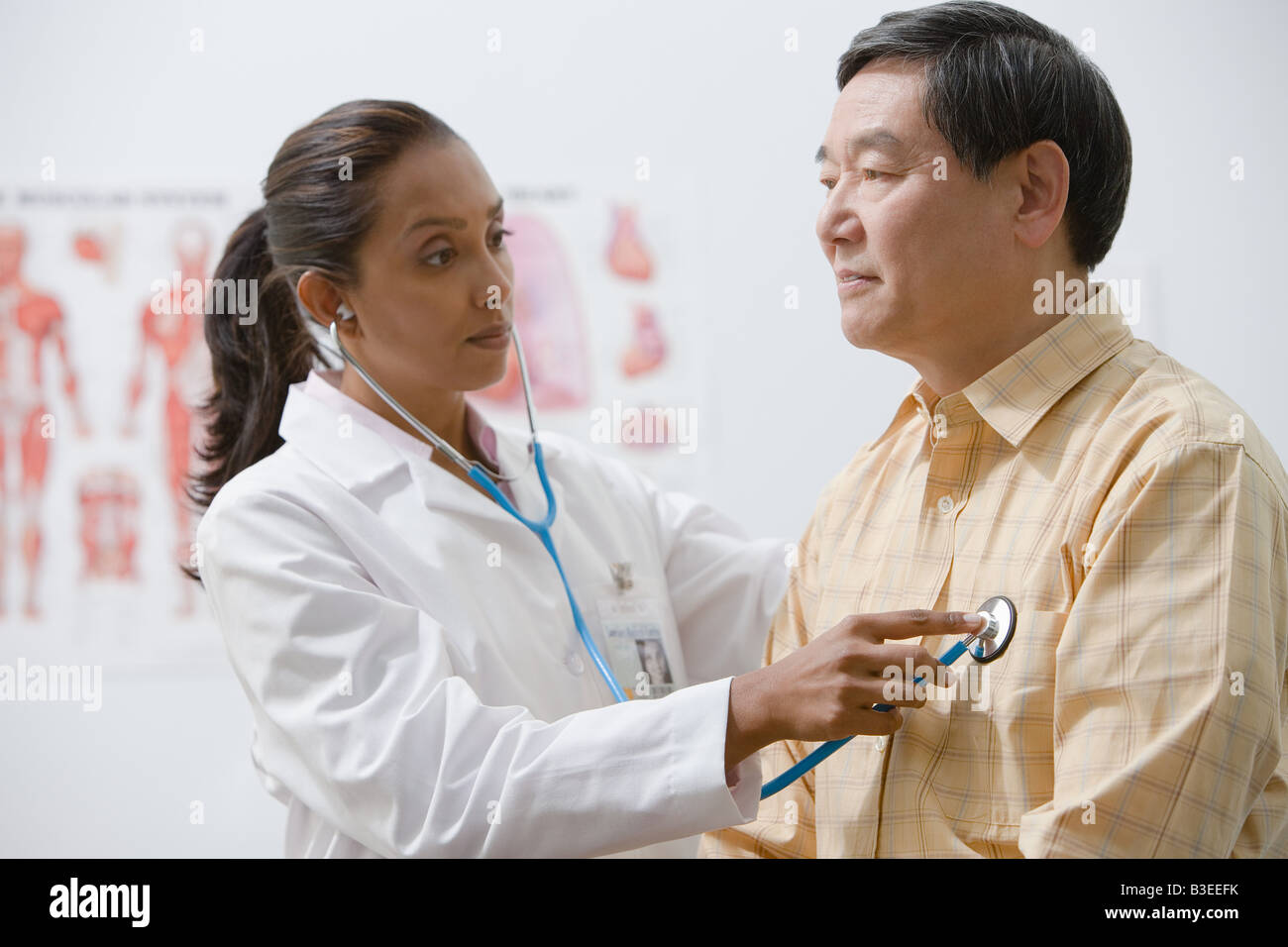 Male doctor examining a patient hi-res stock photography and images - Alamy