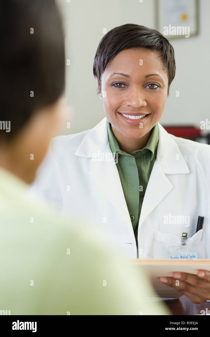 A doctor and a patient Stock Photo - Alamy